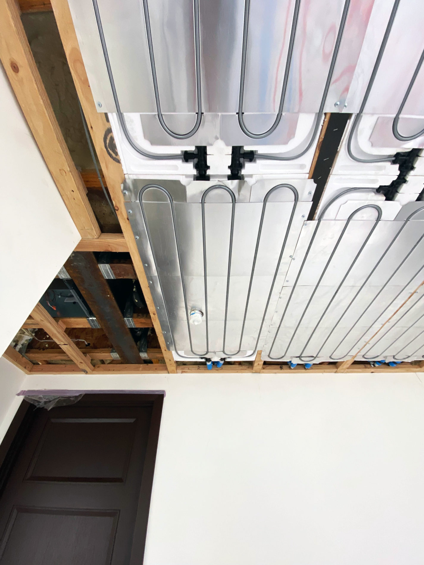 Installing ceiling fixtures with a radiant ceiling